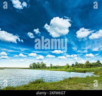 lake in spring with beautiful cloudy sky Stock Photo - Alamy