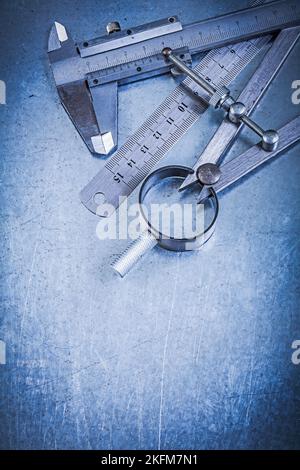 Metal ruler slide caliper construction pair of compasses on metallic ...