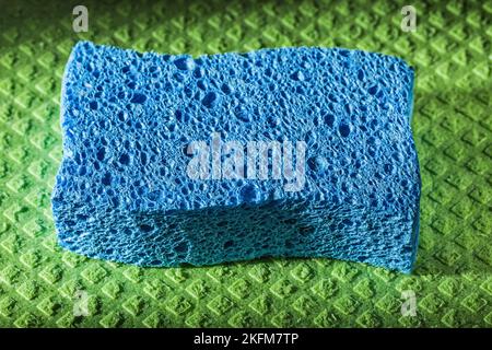 New blue sponge on dishcloth Stock Photo - Alamy