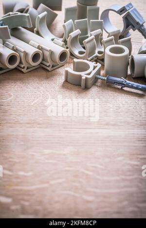 organized copyspace plastic pipe fixators On Wooden Board Stock Photo ...