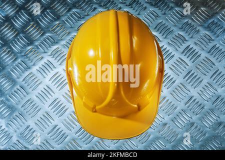 Protective building helmet on grooved metal sheet Stock Photo - Alamy