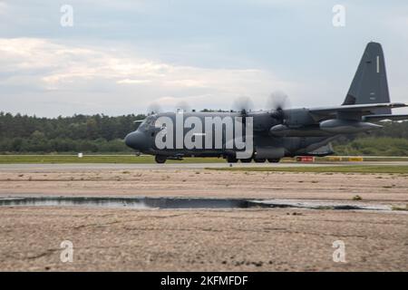 A C-130 Hercules carrying a M142 High-Mobility Artillery Rocket System ...