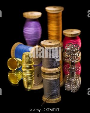 Thimble and spools of sewing threads isolated on white Stock Photo - Alamy