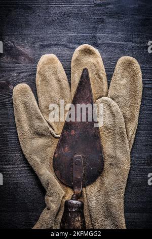 old rusted putty spattle on glove Stock Photo - Alamy