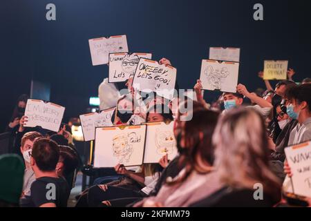 18 November 2022, Berlin: Spectators hold up self-painted posters at ...