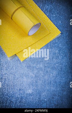 Yellow glass-paper on scratched metallic background abrasive materials ...