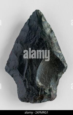 Neolithic obsidian arrowhead on white background Stock Photo - Alamy