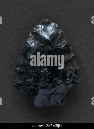 Neolithic obsidian arrowhead on dark background Stock Photo - Alamy