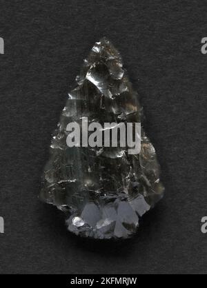 Neolithic obsidian arrowhead on dark background Stock Photo - Alamy