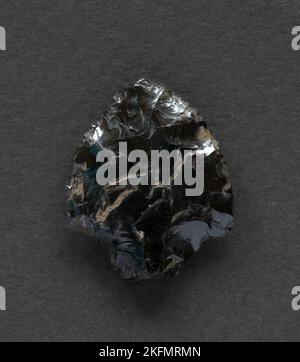 Neolithic obsidian arrowhead on dark background Stock Photo - Alamy