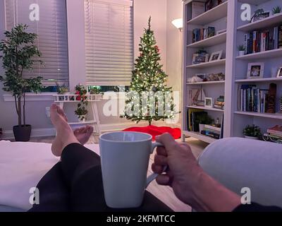 Christmas background with gifts and Christmas tree tea cup fruit Stock ...