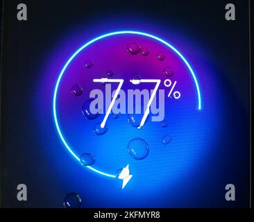 smartphone battery indicator screen with waterdrops Stock Photo - Alamy