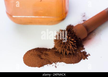 Magnetic brush with fingerprint powder close-up Stock Photo - Alamy