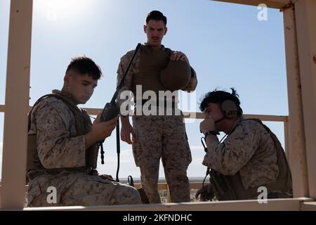 U.S. Marine Corps Sgt. Kyle Carmichael, left, a motor vehicle operator ...