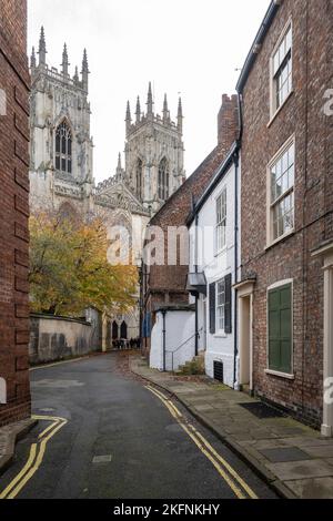 Precentors Court in York. Street scene where a man takes a photo and ...