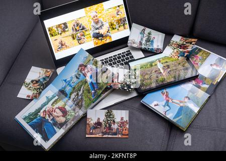 Laptop with photo, photoalbum, album Stock Photo - Alamy