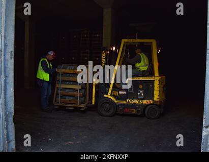 Explosive handlers at Crane Army Ammunition Activity load a railcar for ...