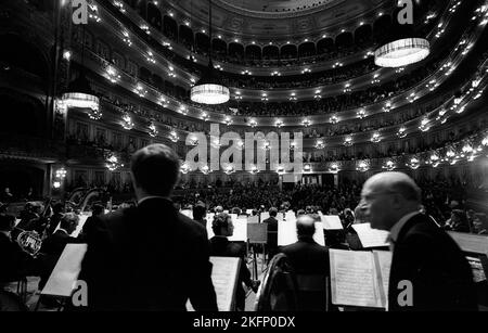Jean Martinon, French orchestra conductor, during a performance with ...