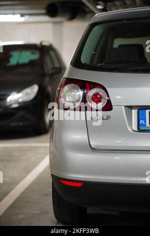 A back of a parked silver colored Volkswagen Golf Plus in a parking ...