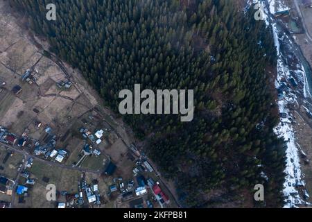 A top view of winter Vorokhta in the Carpathians of Ukraine, a river ...