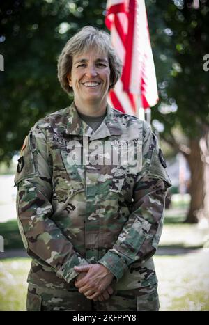 Chaplain (Lt. Col.) Martha Kester smiles in her uniform and parish ...