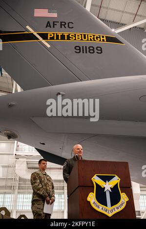 Lt. Col. Jamie Akers, 911th Operations Group commander, cuts a cake ...