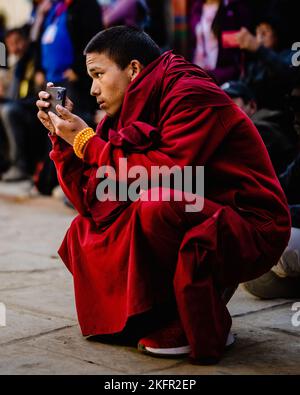 A monk in demon ghost outfit and mask performing Dance at the Tiji ...