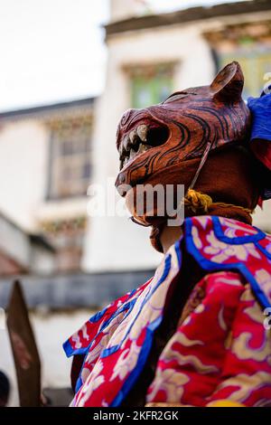 A monk in demon ghost outfit and mask performing Dance at the Tiji ...