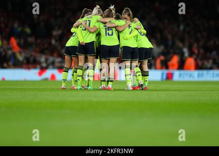 Arsenal players huddle ahead of the second half during the UEFA ...