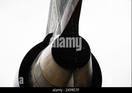 Rain drips from a C-17 Globemaster III engine pylon and tail cone at ...