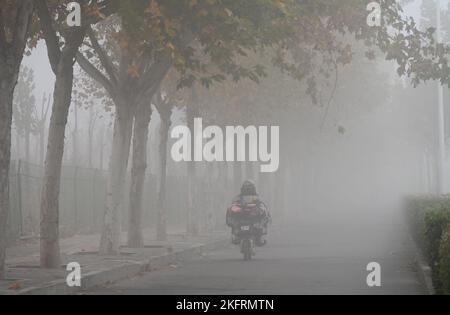 HANDAN, CHINA - NOVEMBER 20, 2022 - Fog-shrouded buildings are seen in ...