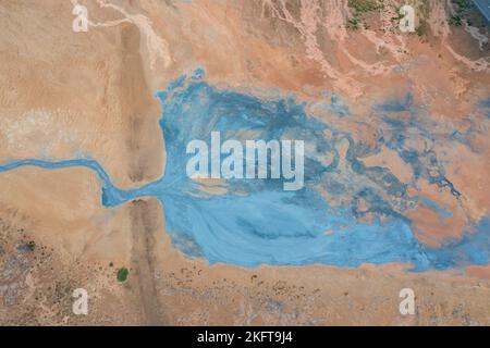 An illustrated abstract blue and beige design - lake and land Stock ...
