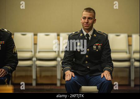 Army Reserve Spc. Brady A. Benedict (center), a military policeman ...