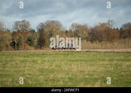 British army MAN HX77 8x8 logistics truck with armed rooftop soldier in ...