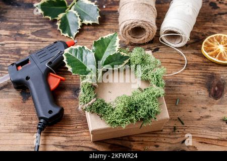 Wrapping Christmas gifts. Hobby time Stock Photo - Alamy
