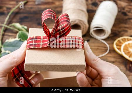 Wrapping Christmas gifts. Hobby time Stock Photo - Alamy