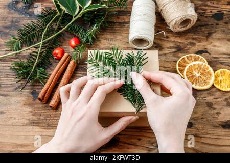 Wrapping Christmas gifts. Hobby time Stock Photo - Alamy