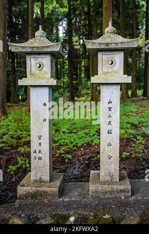 Japanese stone toro lanterns at shrine entrance in the forest Stock ...