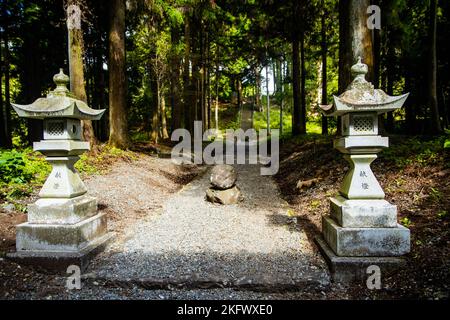 Yamamiya Sengen Shrine temple entrance with stone toro lanterns at the ...