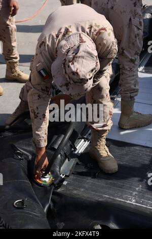 Marines from Company A, 1ST Reconnaissance Battalion, practice rowing ...
