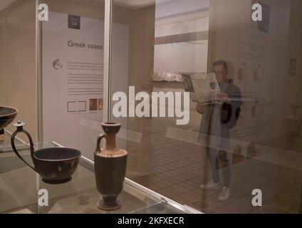 Visitor to the Ancient Greece section of the British Museum in London ...