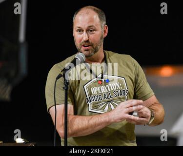 Jason Michaels, a magician with Operation Magic All Stars, performs a ...