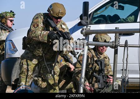 A team of 91st Security Forces Group Defenders search for threats ...