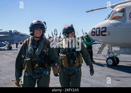 Rear Adm. Greg Huffman, left, commander, Carrier Strike Group (CSG) 12 ...