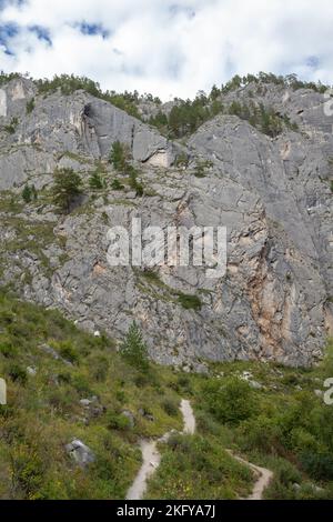 A large mountain with a sheer cliff close-up against the sky Stock ...