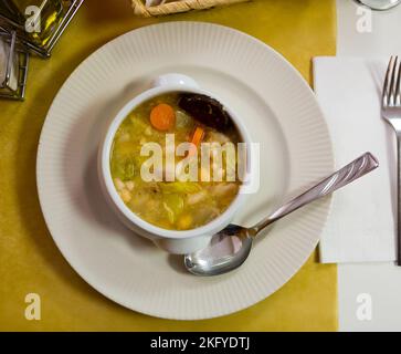 Catalan soup of bean with boiled carrots, potatoes and blood sausage ...