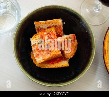 Traditional Catalan food, pan con tomate, served on plate Stock Photo ...