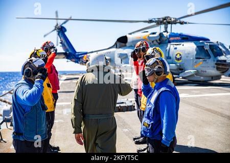 Rear Adm. Greg Huffman, center, commander, Carrier Strike Group (CSG ...
