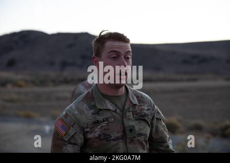 Spc. Logan Phillips, representing the 97th Troop Command, checks his ...