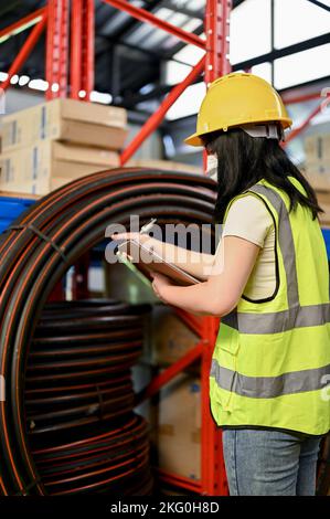 Portrait, Professional Asian female industrial engineer or worker in ...